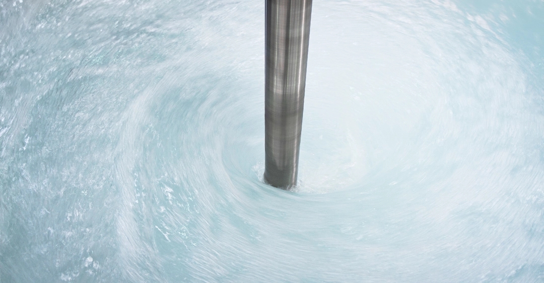What is an industrial agitator and its components?