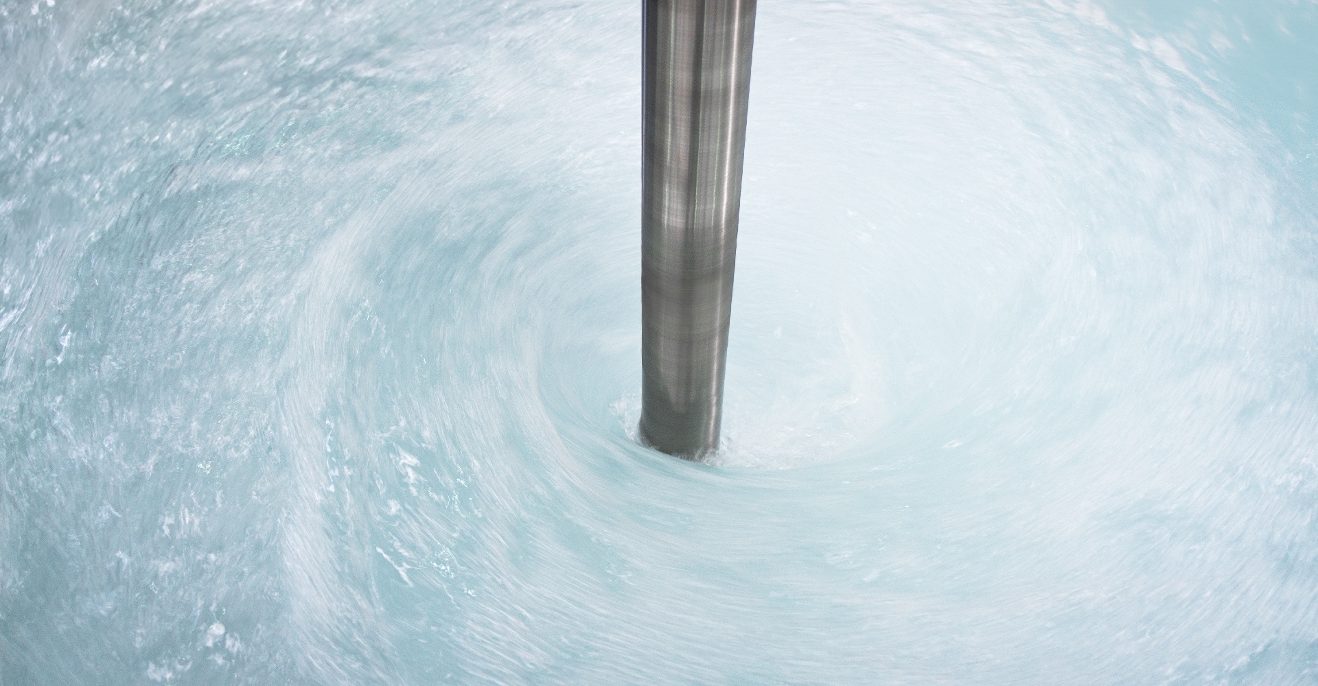 What is an industrial agitator and its components?